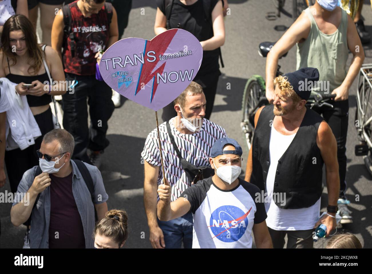 People attend the Trans Pride March in Berlin on July 10, 2021. (Photo ...