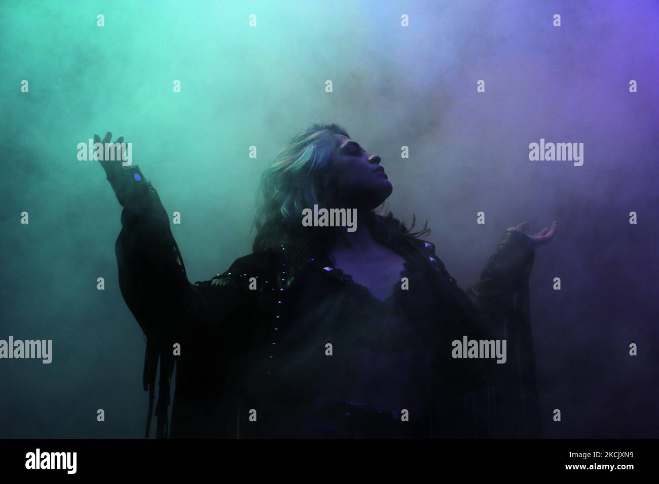 An actress dances through smoke inside the Teatro de la Ciudad ...