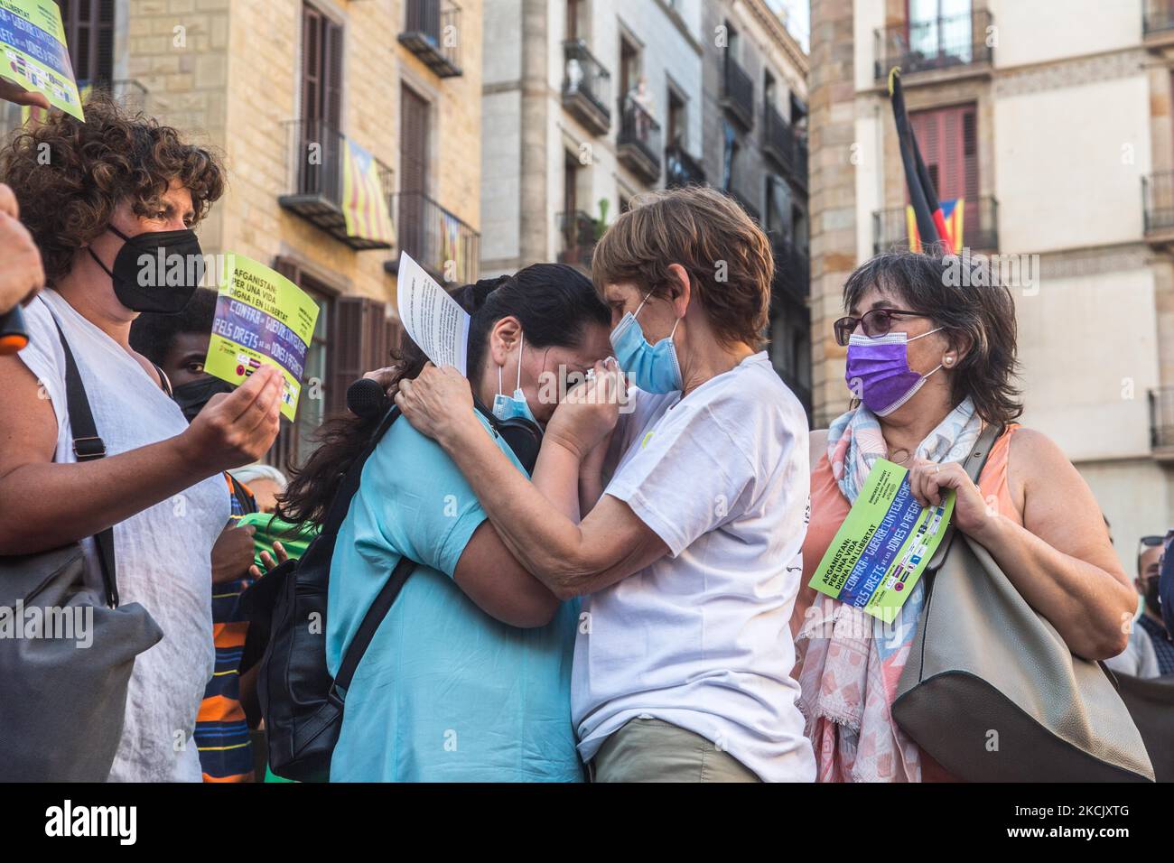 Protester in tears is being hugged by another protester. Some five ...