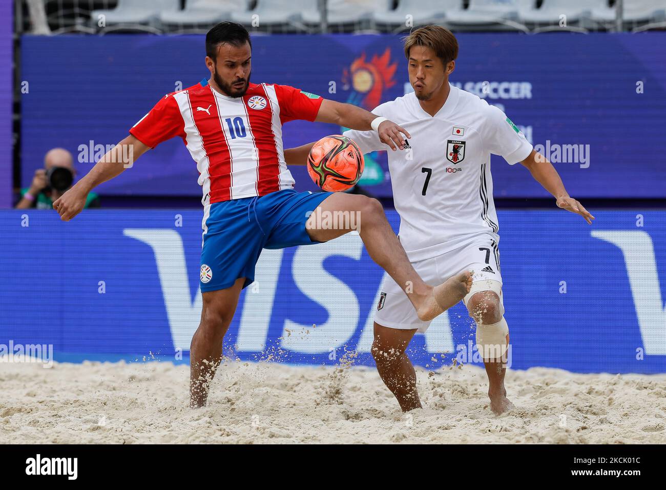 Valentin Benitez (L) of Paraguay and Takaaki Oba of Japan in action ...