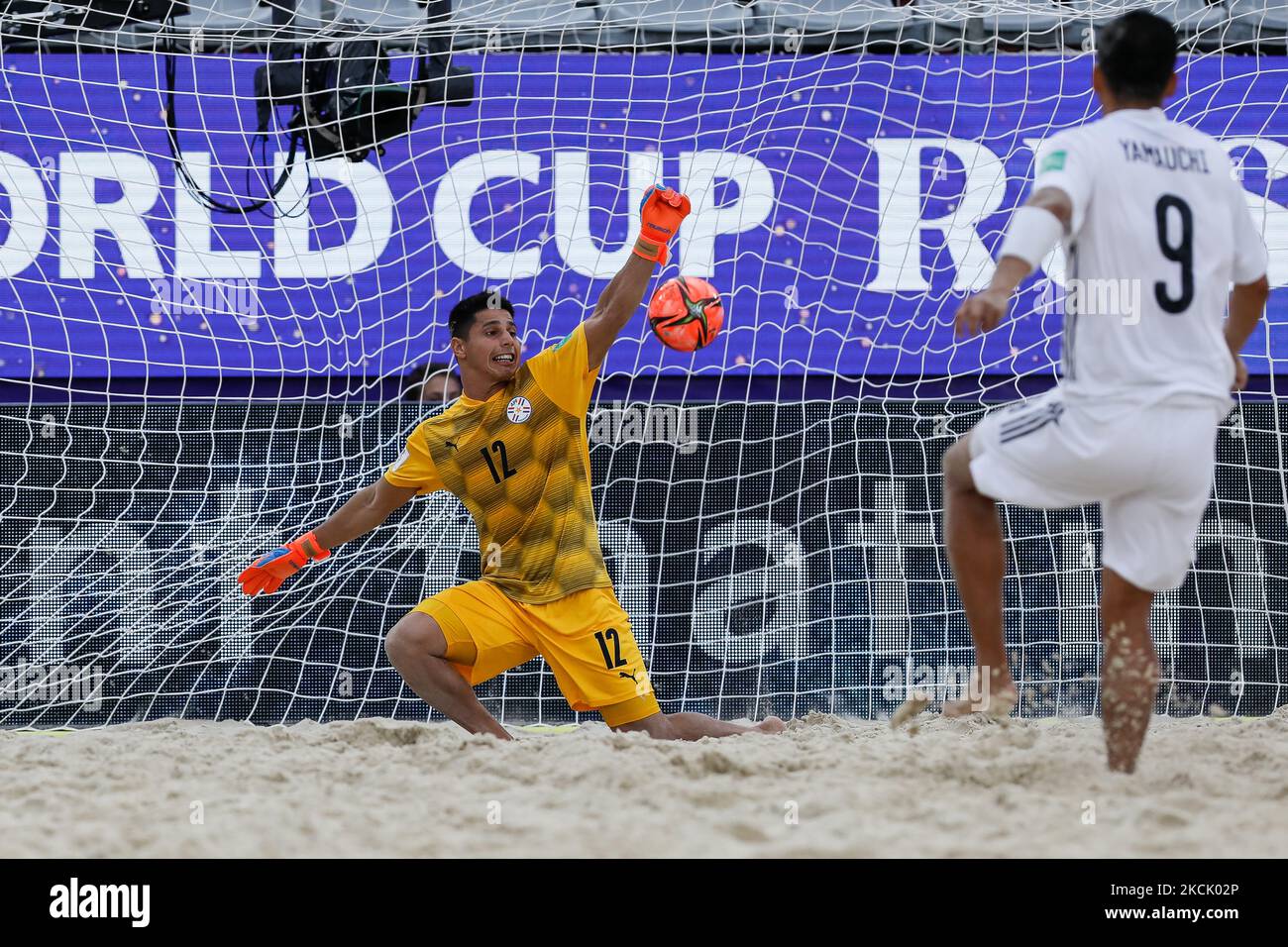 Yoao Rolon (C) of Paraguay fails to save a shot by Shusei Yamauchi of ...