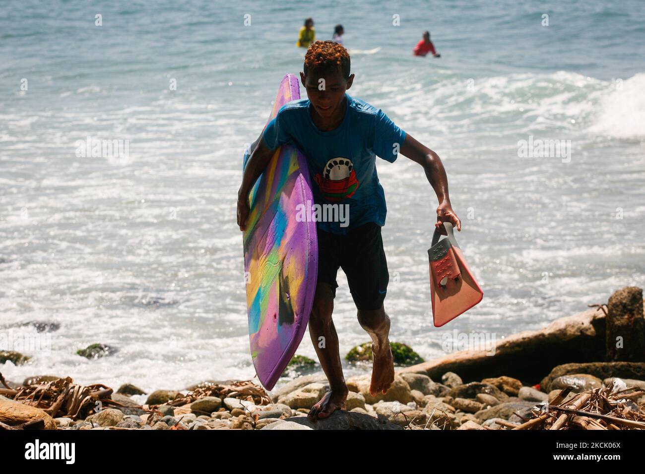 A boy comes out of the water during the first stop of the Live ...