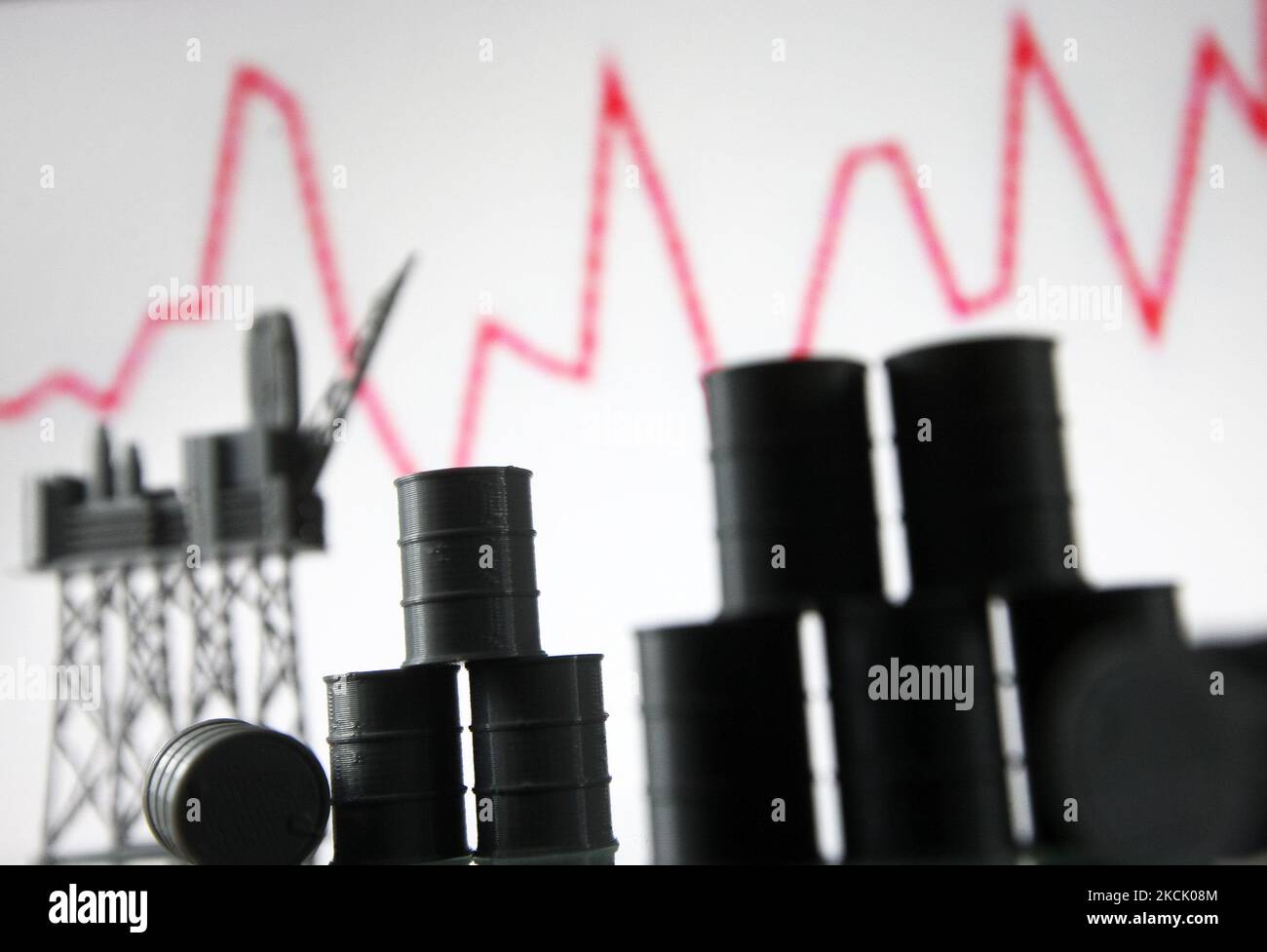 Models of a mariner oil rig, barrels and a graphic are pictured in this ...