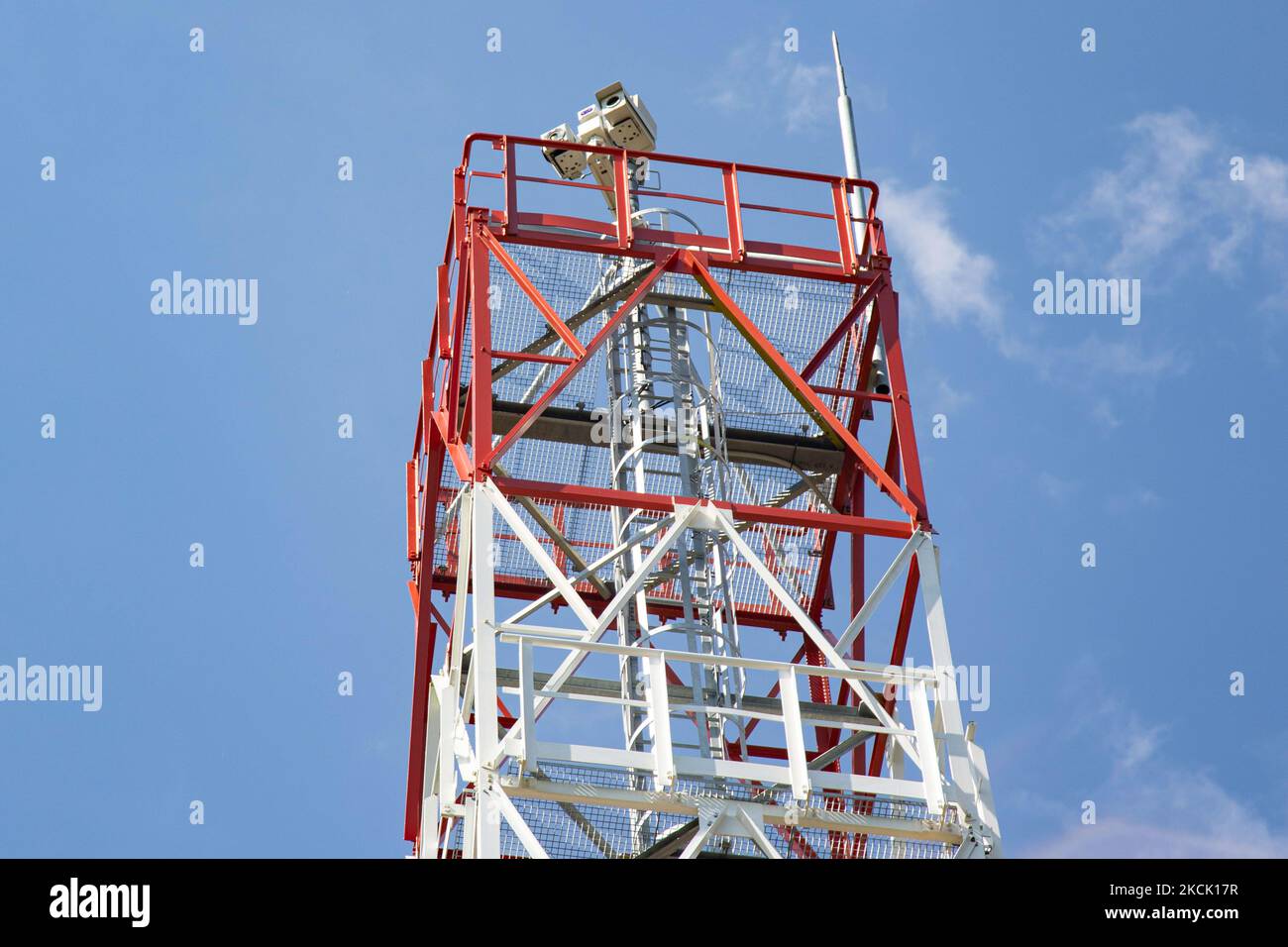 TA police car infront of the new towers equiped with zoom cameras ...