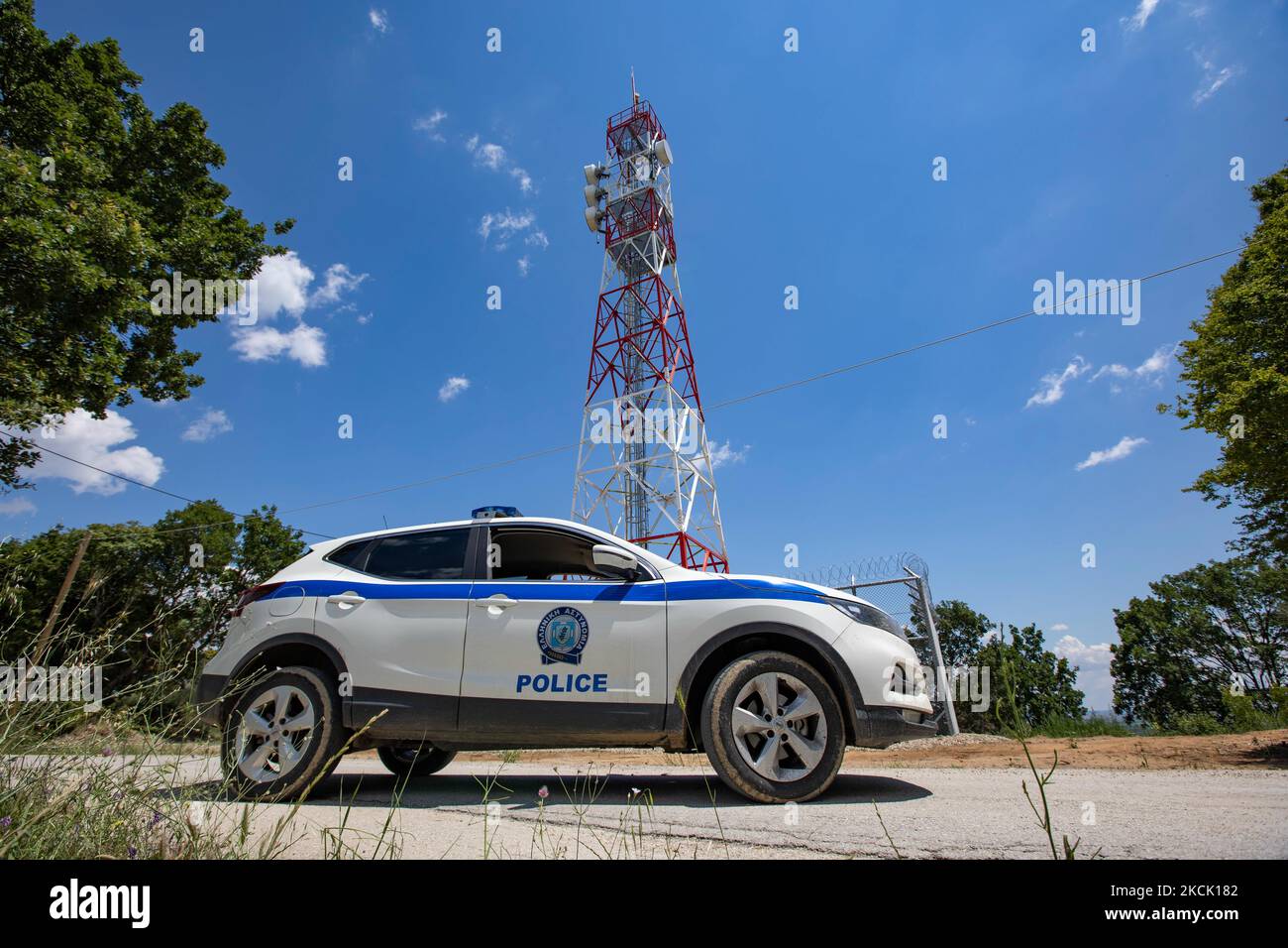 TA police car infront of the new towers equiped with zoom cameras ...