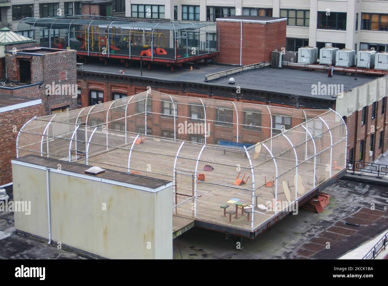 Rooftop playgrounds offer children a safe play space on top of large ...