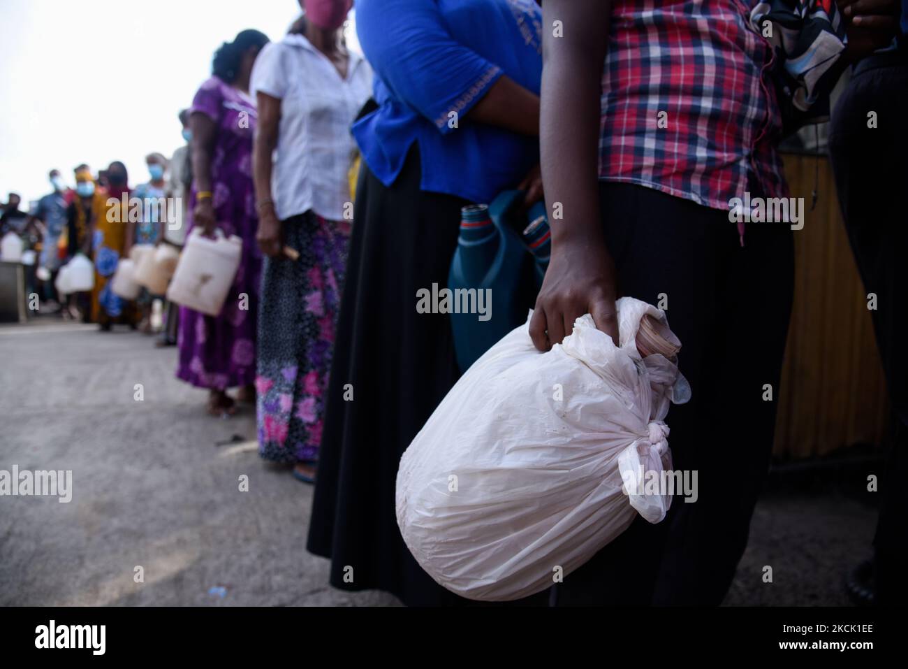 People waiting in a queue in the kerosene oil station in Colombo, Sri ...