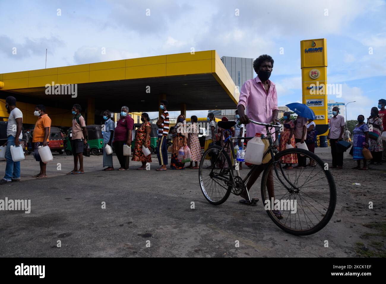 People waiting in a queue in the kerosene oil station in Colombo, Sri ...