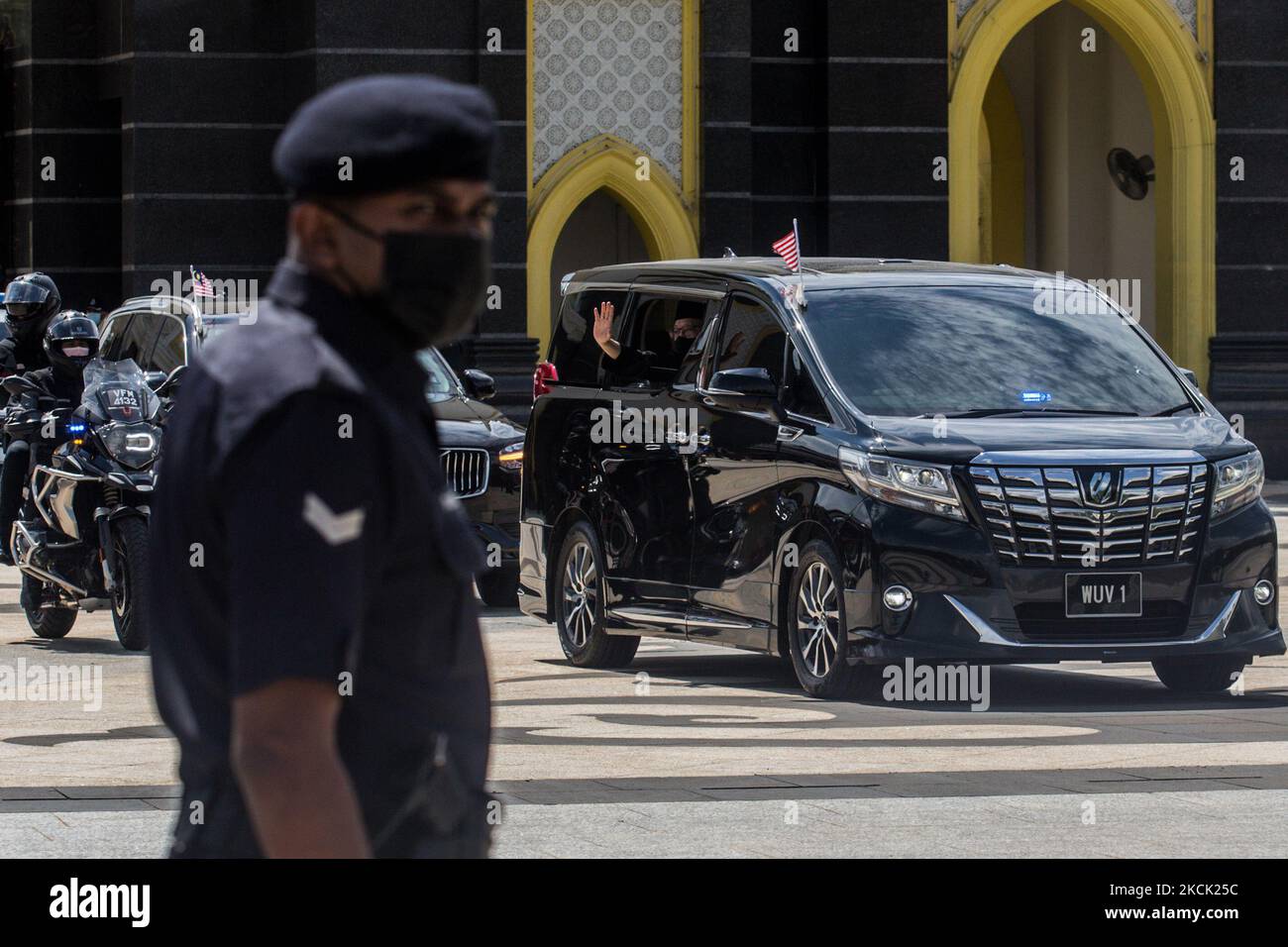 New Malaysian Prime Minister Ismail Sabri Yaakob waves from a car, as ...