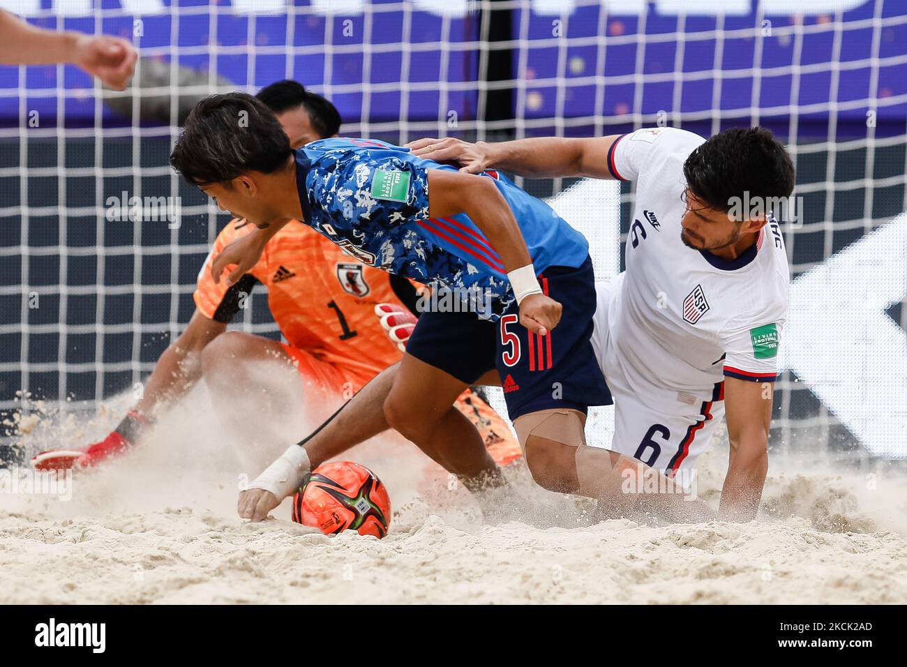 Jason Santos (R) of USA vies for the ball with Shotaro Haraguchi (C ...