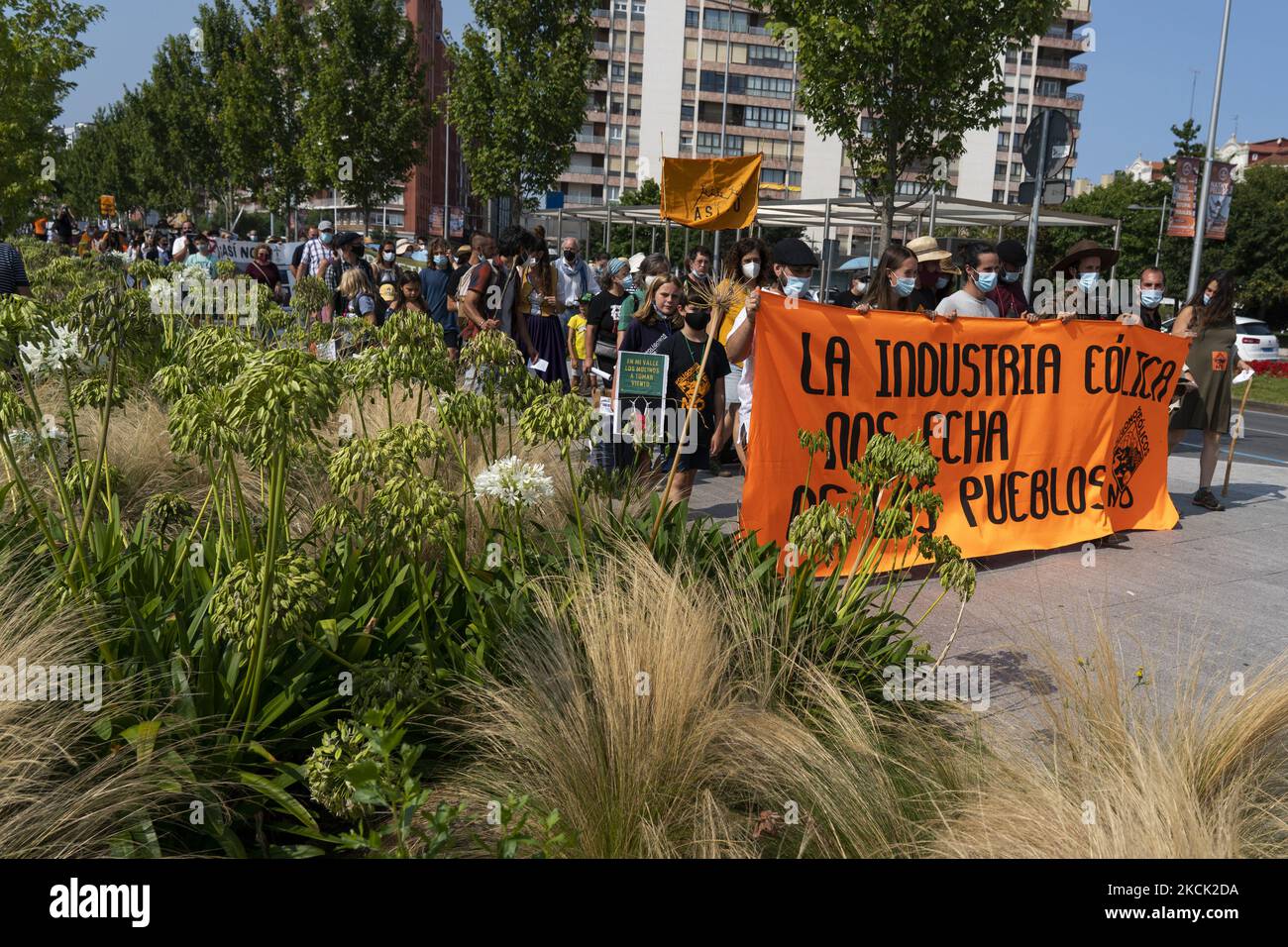 The banner with the slogan "the wind industry drives us out of the ...
