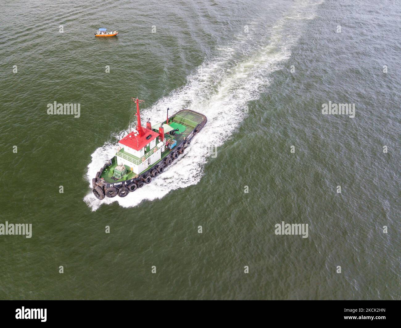 A tug boat passes at the large of Lei Yuen Mun in this picture by drone ...