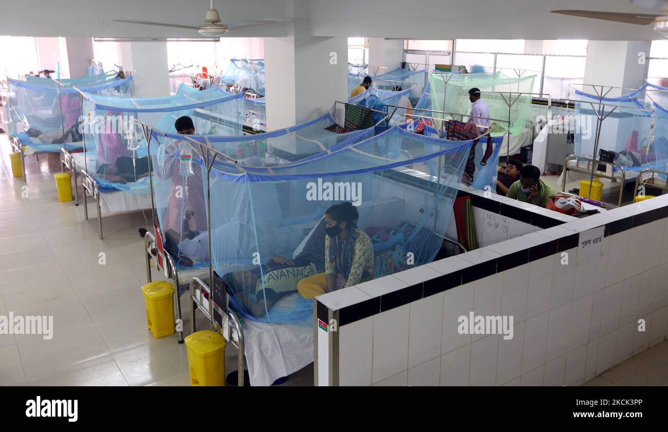 Patients lie under mosquito nets in the dengue ward of Mitford Hospital ...