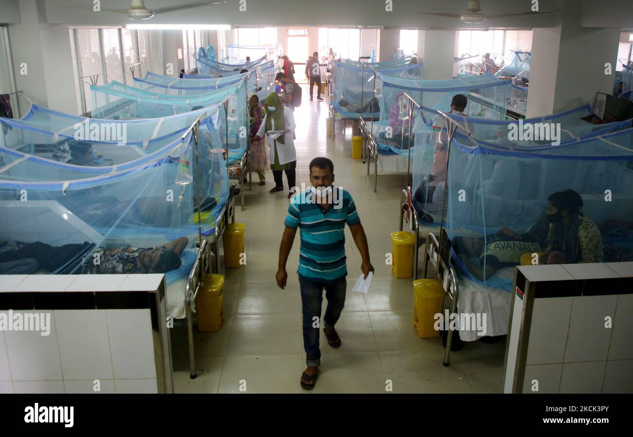 Patients lie under mosquito nets in the dengue ward of Mitford Hospital ...