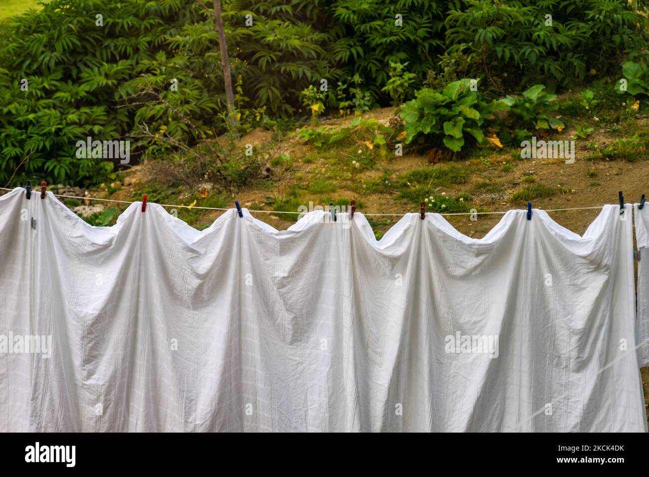 Clean laundry line with pins outdoor Stock Photo - Alamy