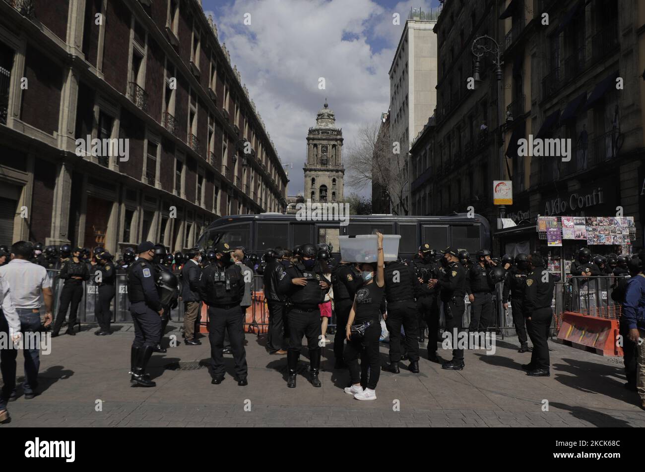 Police officers guard the streets of the Historic Centre of Mexico City ...