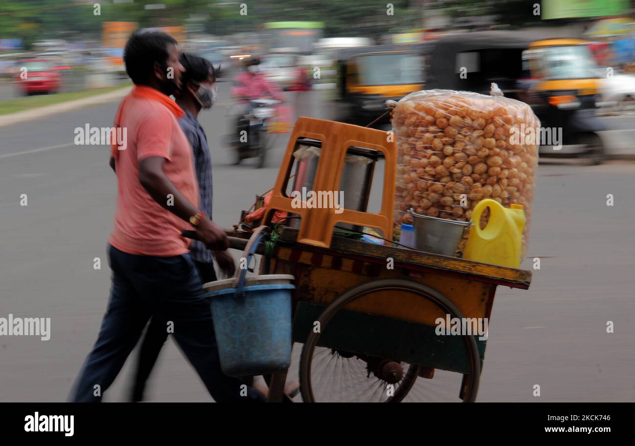 Vendors are seen along with their vending trolley and bicycles as they ...