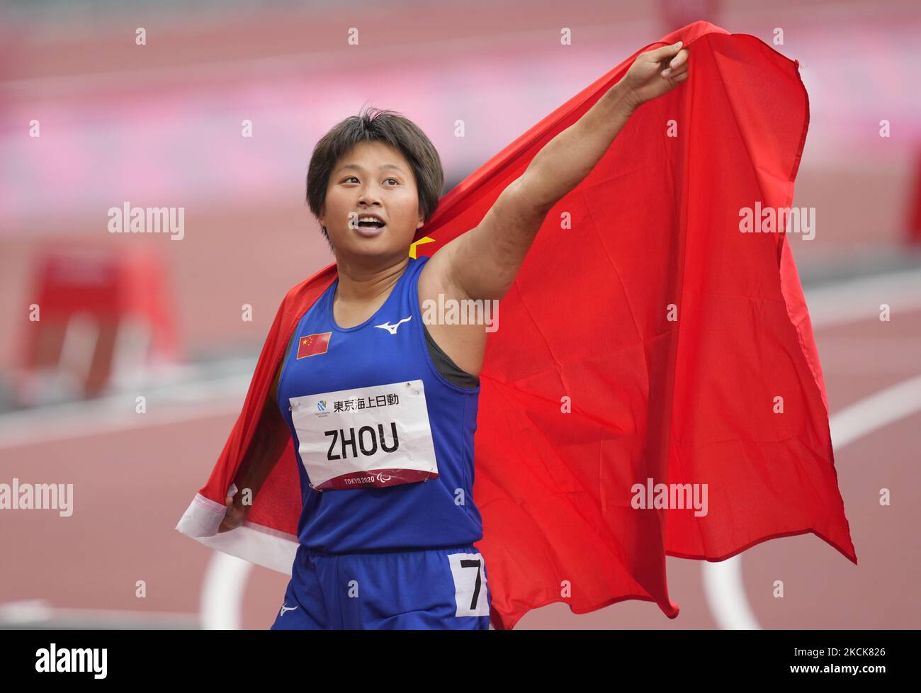 Xia Zhou from China winning gold at 100m and beating the world record during athletics at the ...
