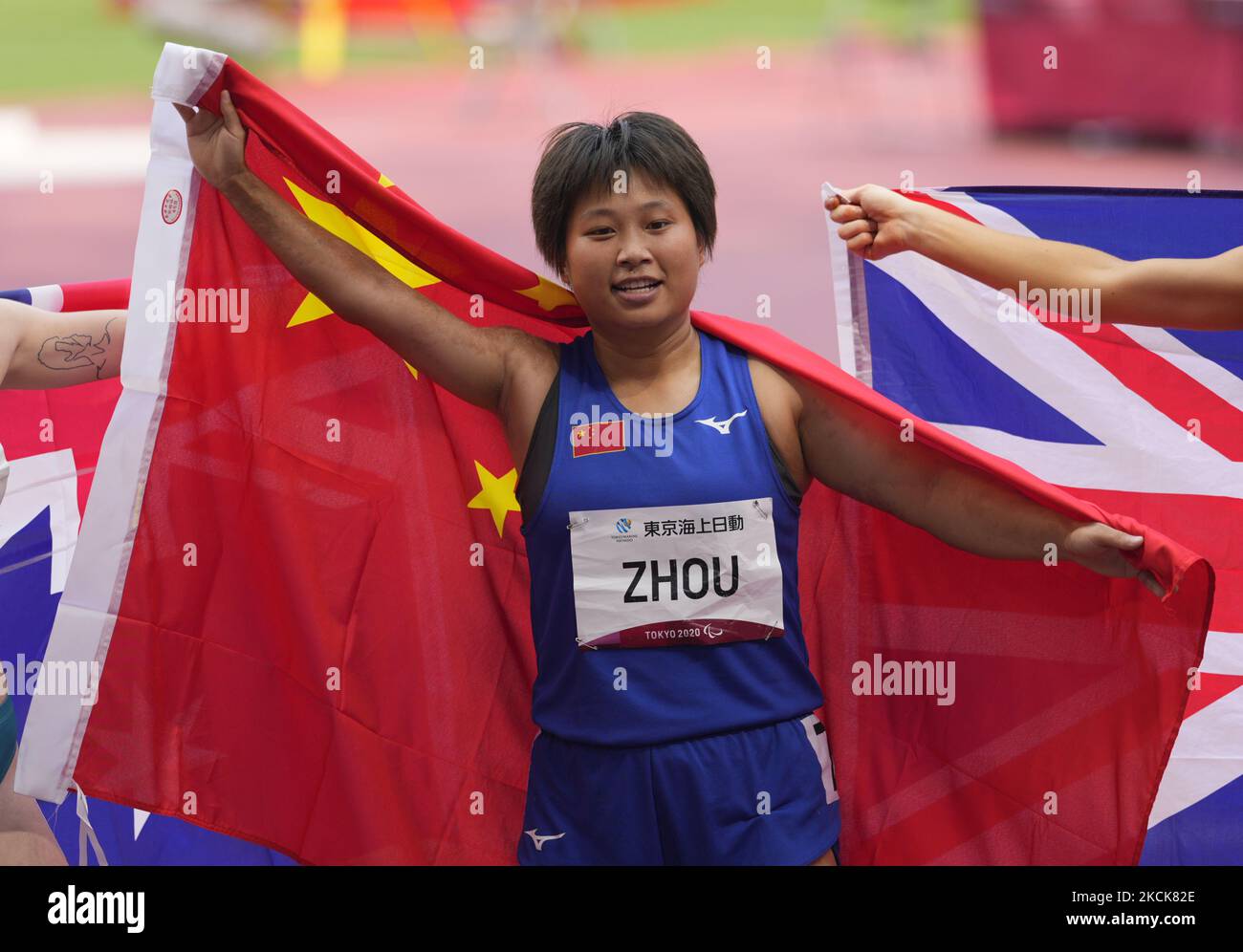 Xia Zhou from China winning gold at 100m and beating the world record during athletics at the ...