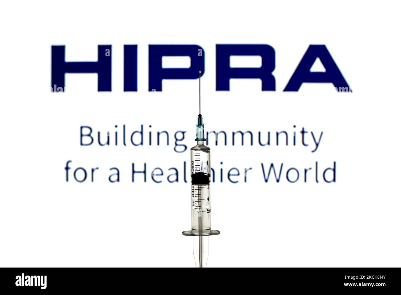 In this photo illustration, a close up of a medical syringe in front of ...