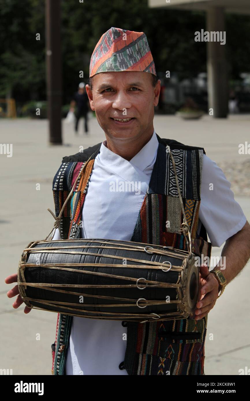 Nepali musician plays a traditional Nepalese drum during the Nepali ...