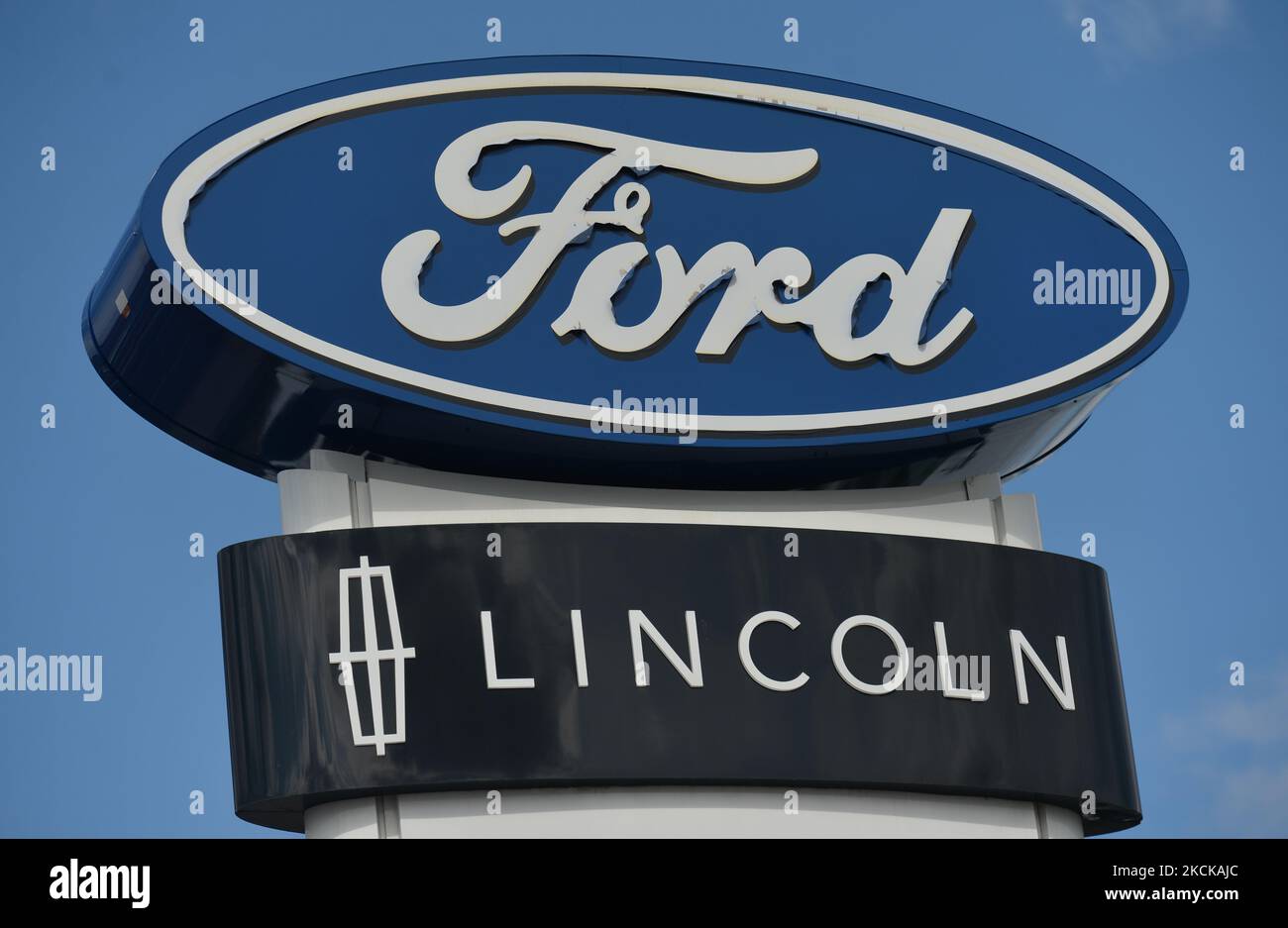 Ford and Lincoln logos seen on a parked Ford vehicles outside a Ford ...