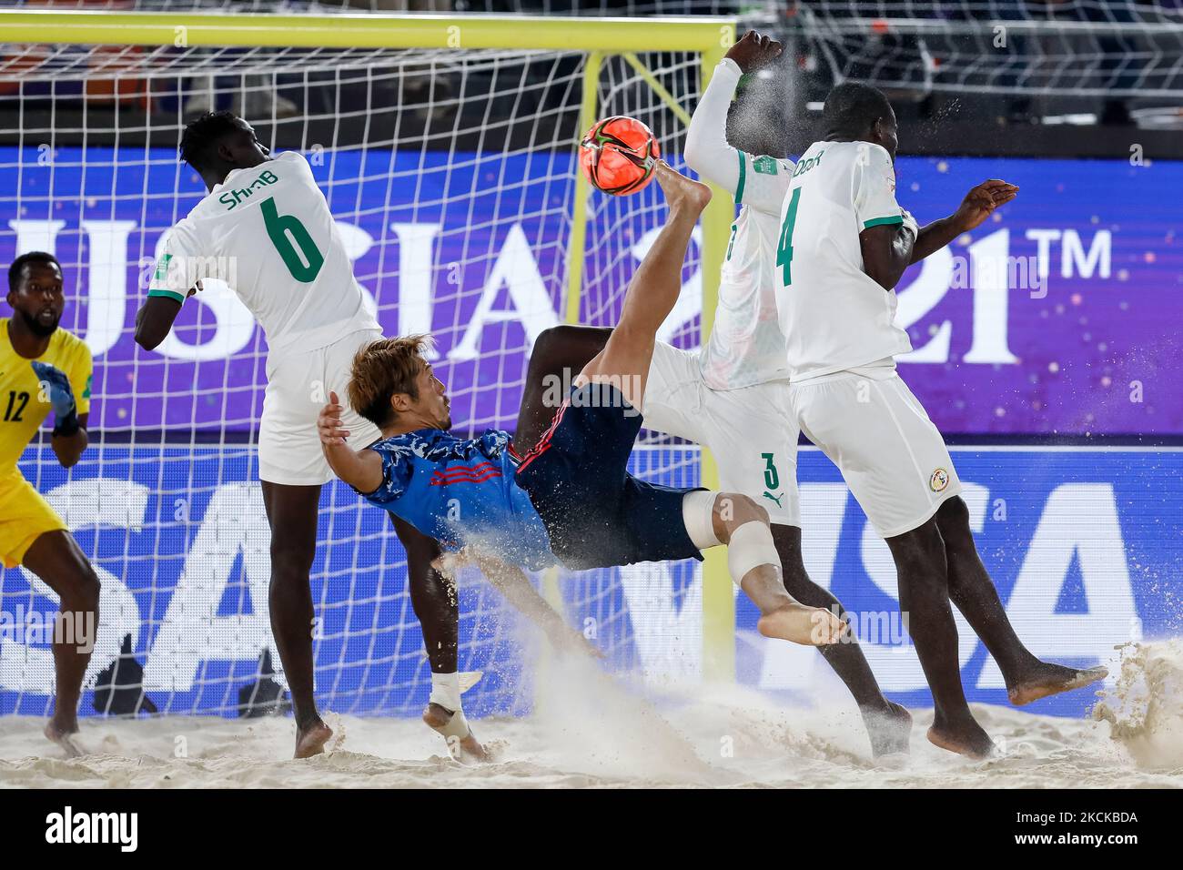 Takaaki Oba (C) of Japan shoots to score a goal as Amadou Ba (N12 ...