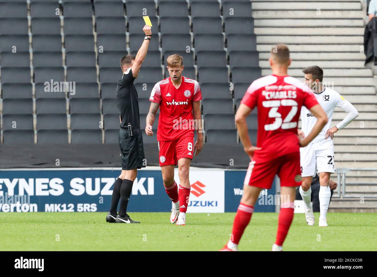 Referee Declan Bourne shows a yellow card to Accrington Stanley's Harry ...