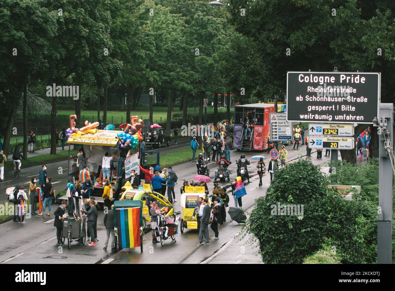the sign of " road is closed due to Cologne pride parade" is seen ...
