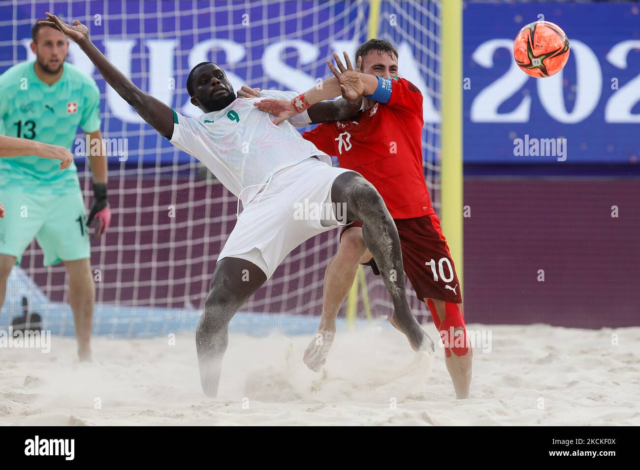 Noel Ott (R) of Switzerland and Raoul Mendy of Senegal vie for the ball ...
