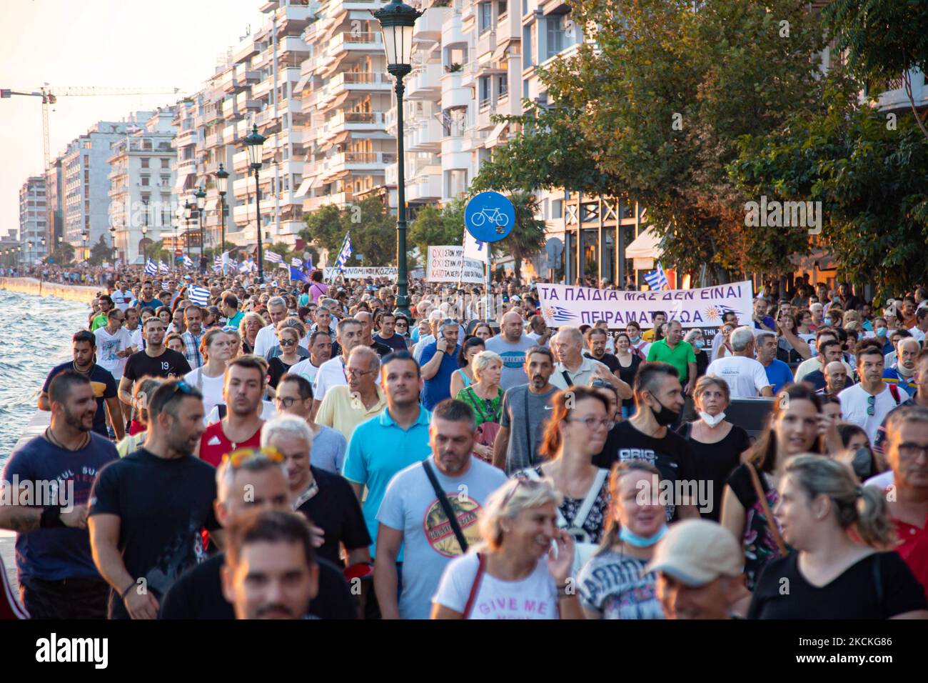 Thousands of protesters at the seafront of Thessaloniki holding Greek ...