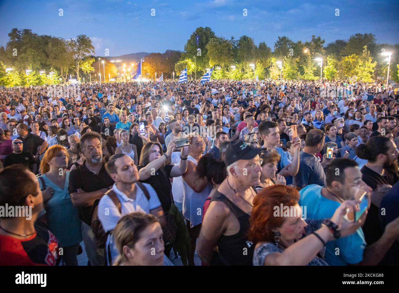 A priest is talking in front of thousands of people against the ...