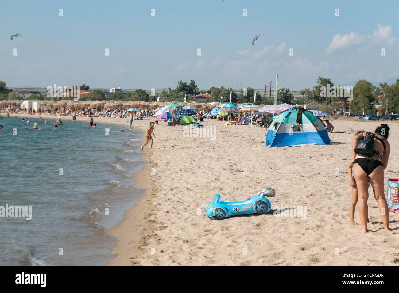 Greece beach bikini family hi-res stock photography and images - Alamy