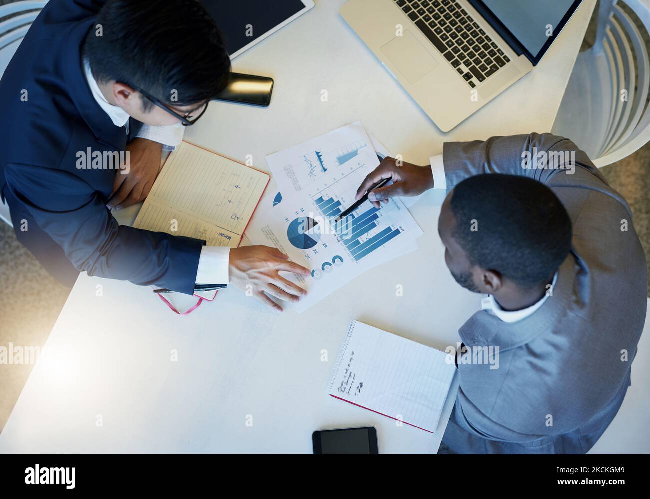 Transforming data and information into insights. High angle shot of two ...