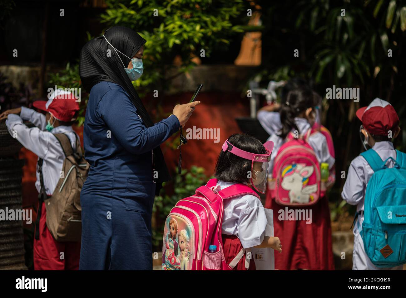 Children getting ready for class, in Jakarta, Indonesia, on August 30 ...