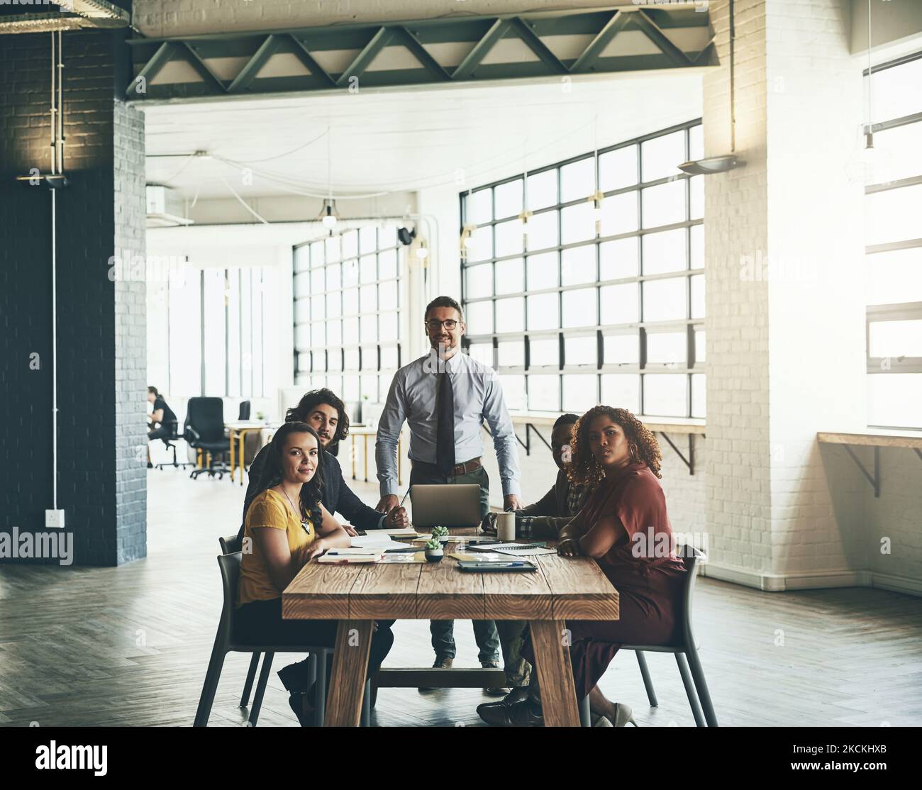 Smiling men around table hi-res stock photography and images - Alamy