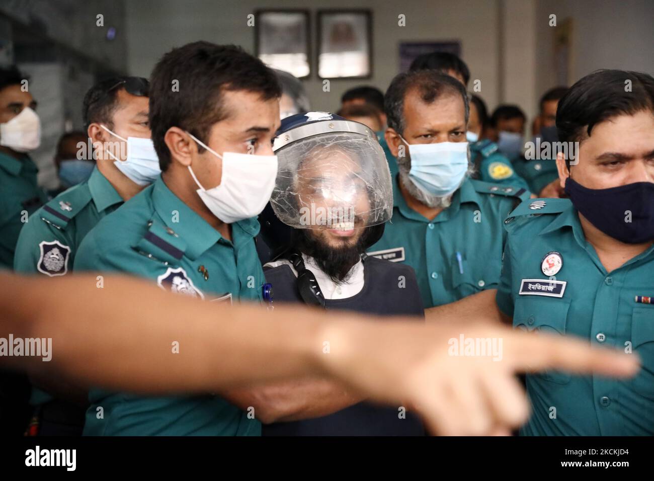 Police persons escort convicted man after Dhaka Anti-Terrorism Tribunal sentenced death to six ...