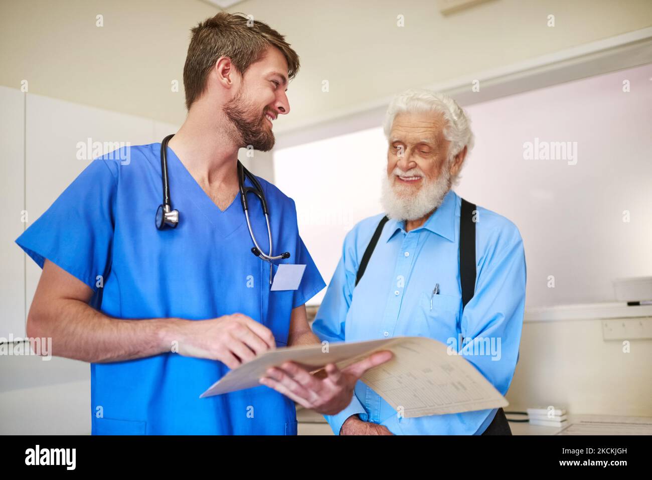 Your file shows great progress. a young doctor and his senior patient ...