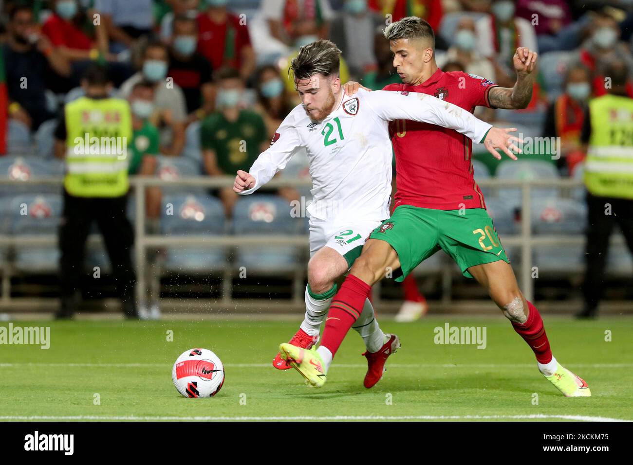 Republic of Ireland's forward Aaron Connolly (L) vies with Portugal's ...