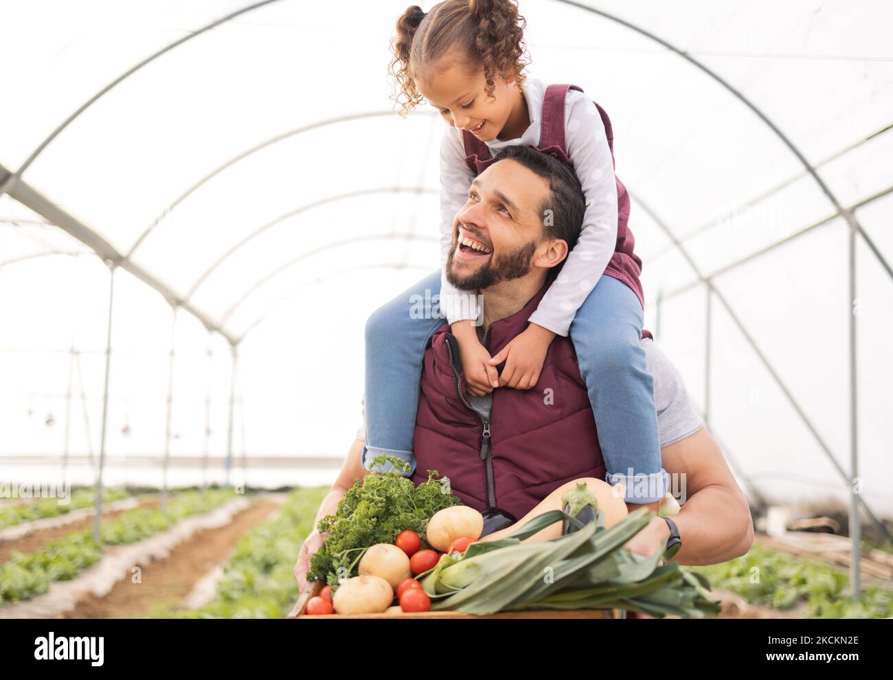 Family, agriculture and farming with father and child together in a ...