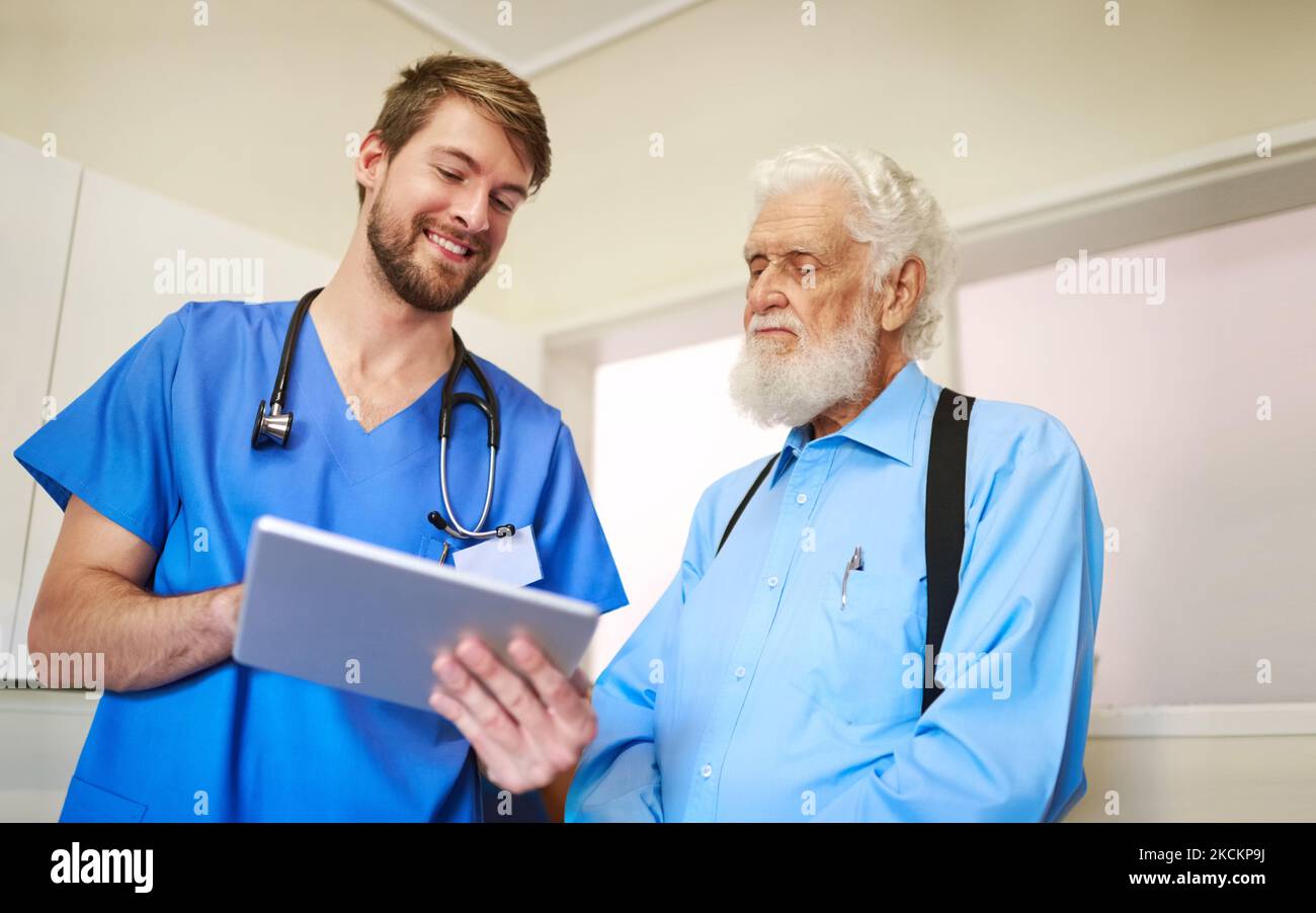 Let me walk you through my treatment plan. a young doctor explaining a ...