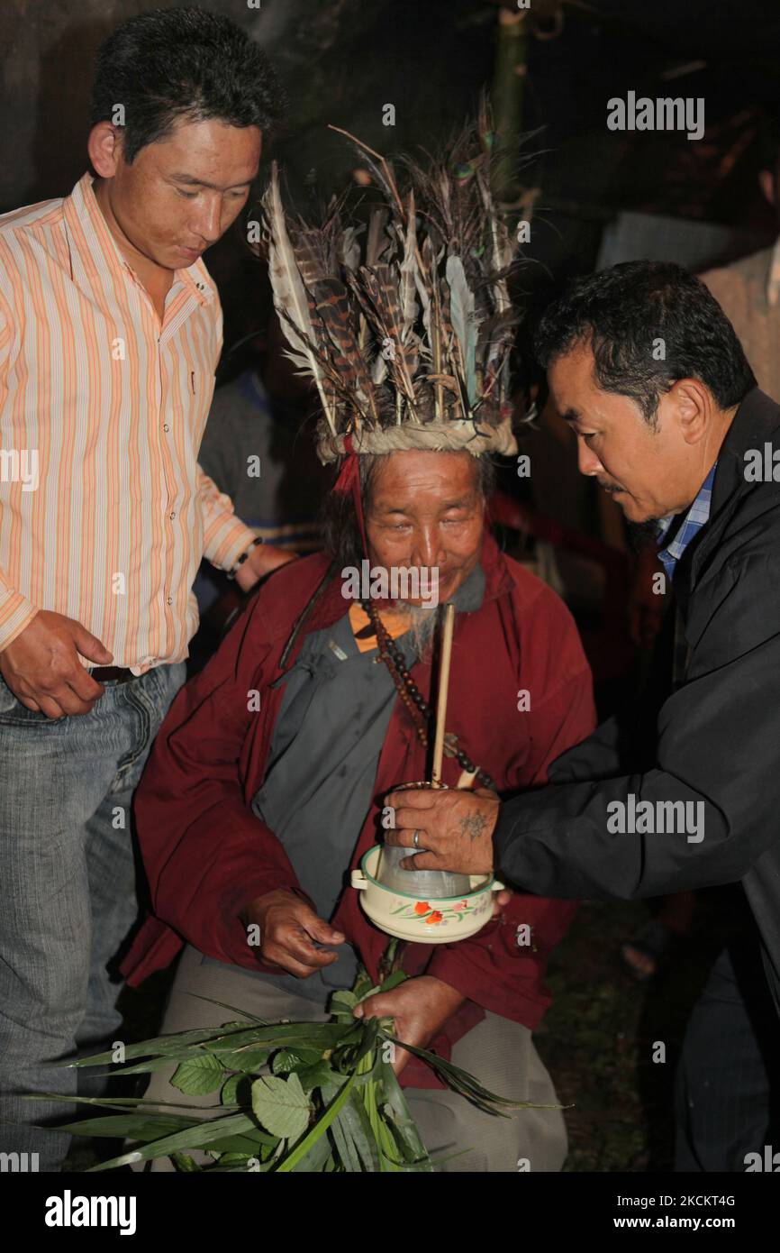 A 90 year-old Lepcha Bomthing (Lepcha priest) drinks che (a traditional ...
