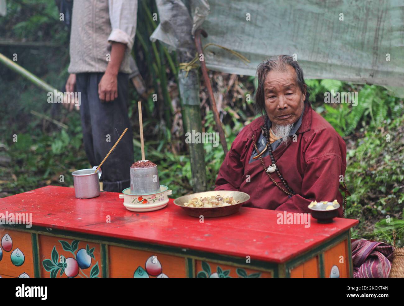 A 90 year-old Lepcha Bomthing (Lepcha priest) chants prayers during an ...