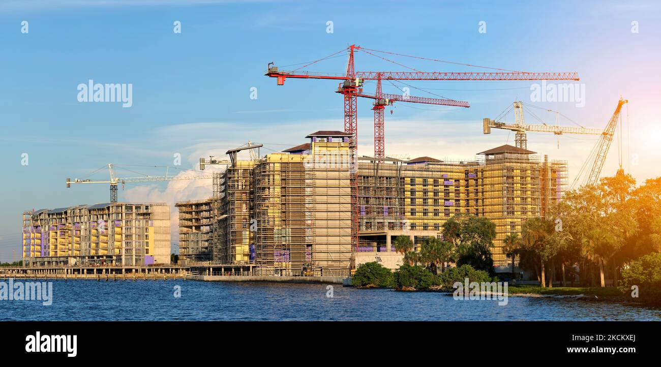 Tower lifting cranes at high residential apartment buildings ...