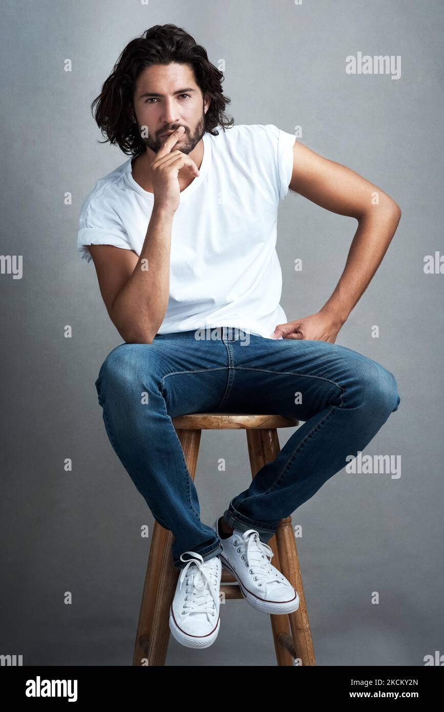 Classic brooding good looks. Studio shot of a handsome young man ...