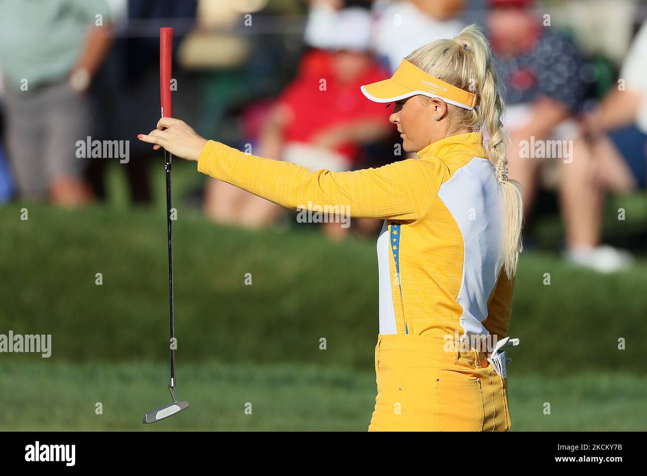 Charley Hull of Team Europe lines up her putt on the 8th green during ...