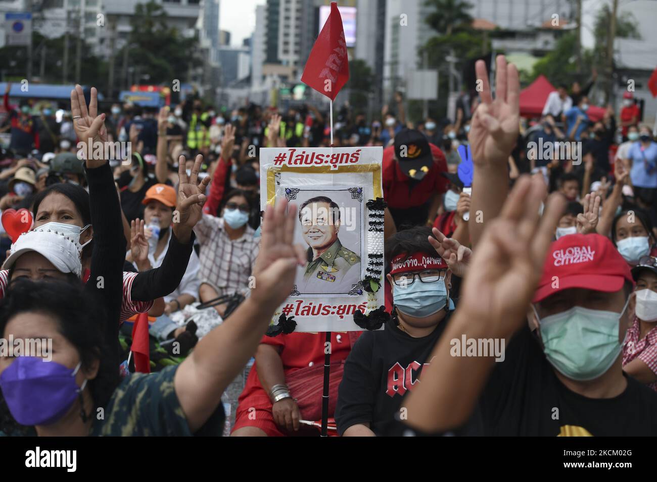 Anti-government protesters flash the three-finger salute as they occupy ...