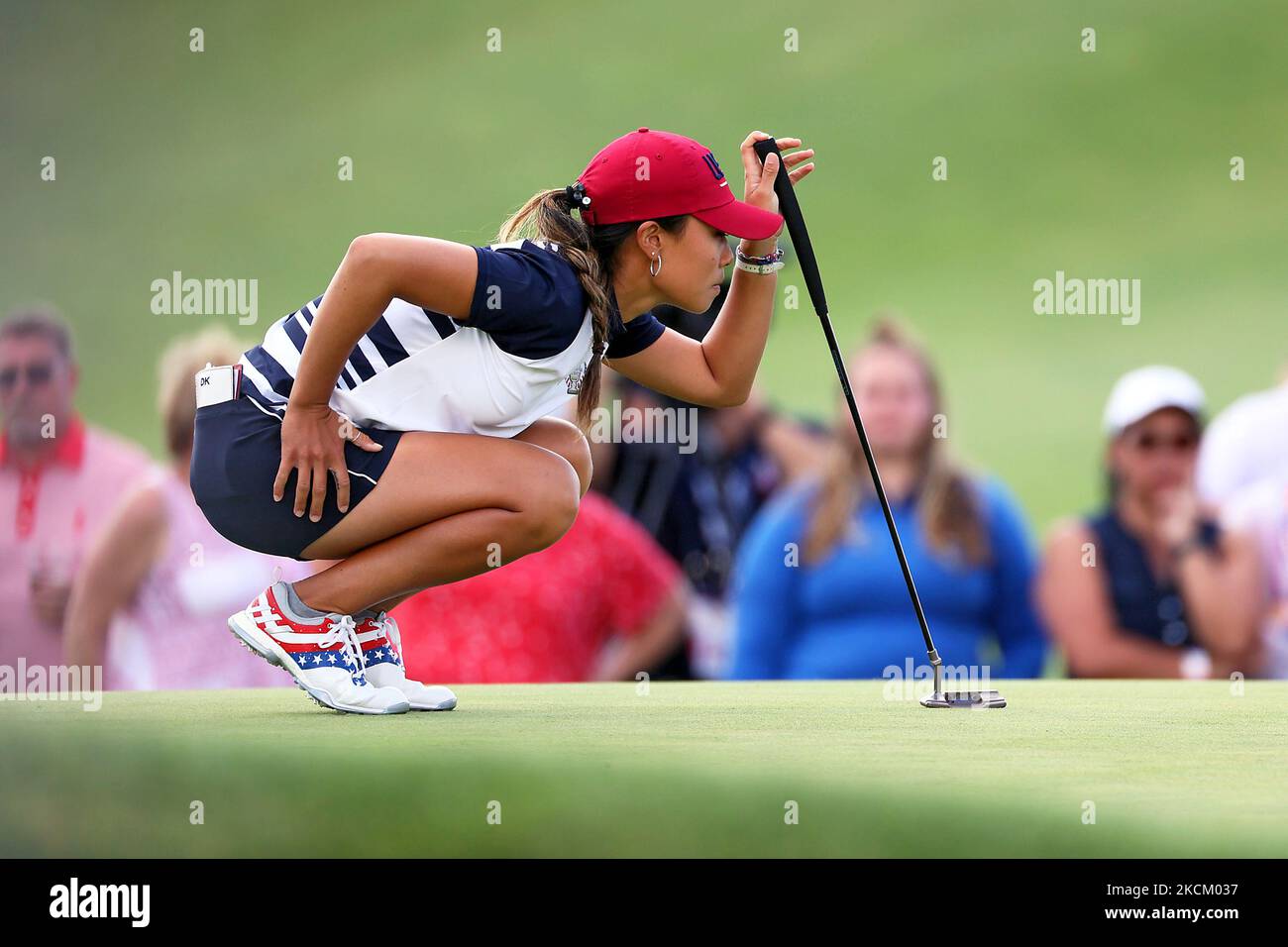 Danielle Kang of Team USA lines up her putt on the 9th green during the ...