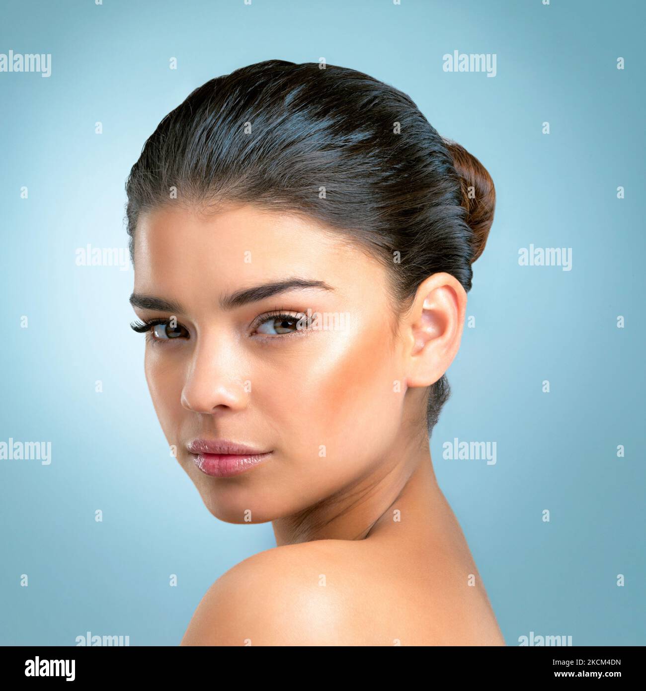 Simple is beautiful. Studio shot of a beautiful young woman with perfect skin posing against a ...