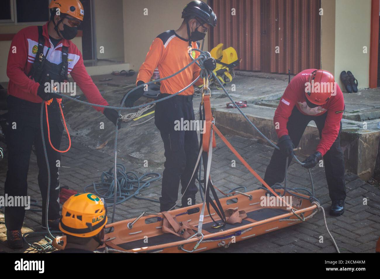 Personel of National Search and Rescue Agency (BASARNAS) rescue the ...